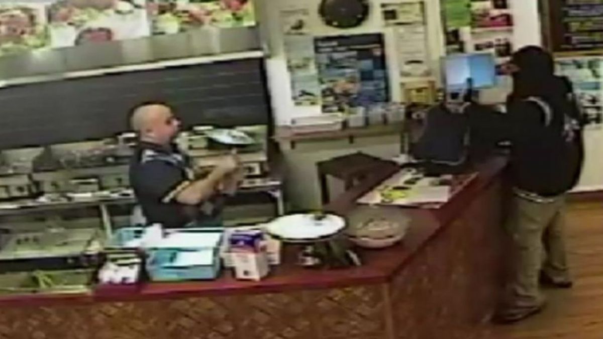 Fast food boss ignores armed robber